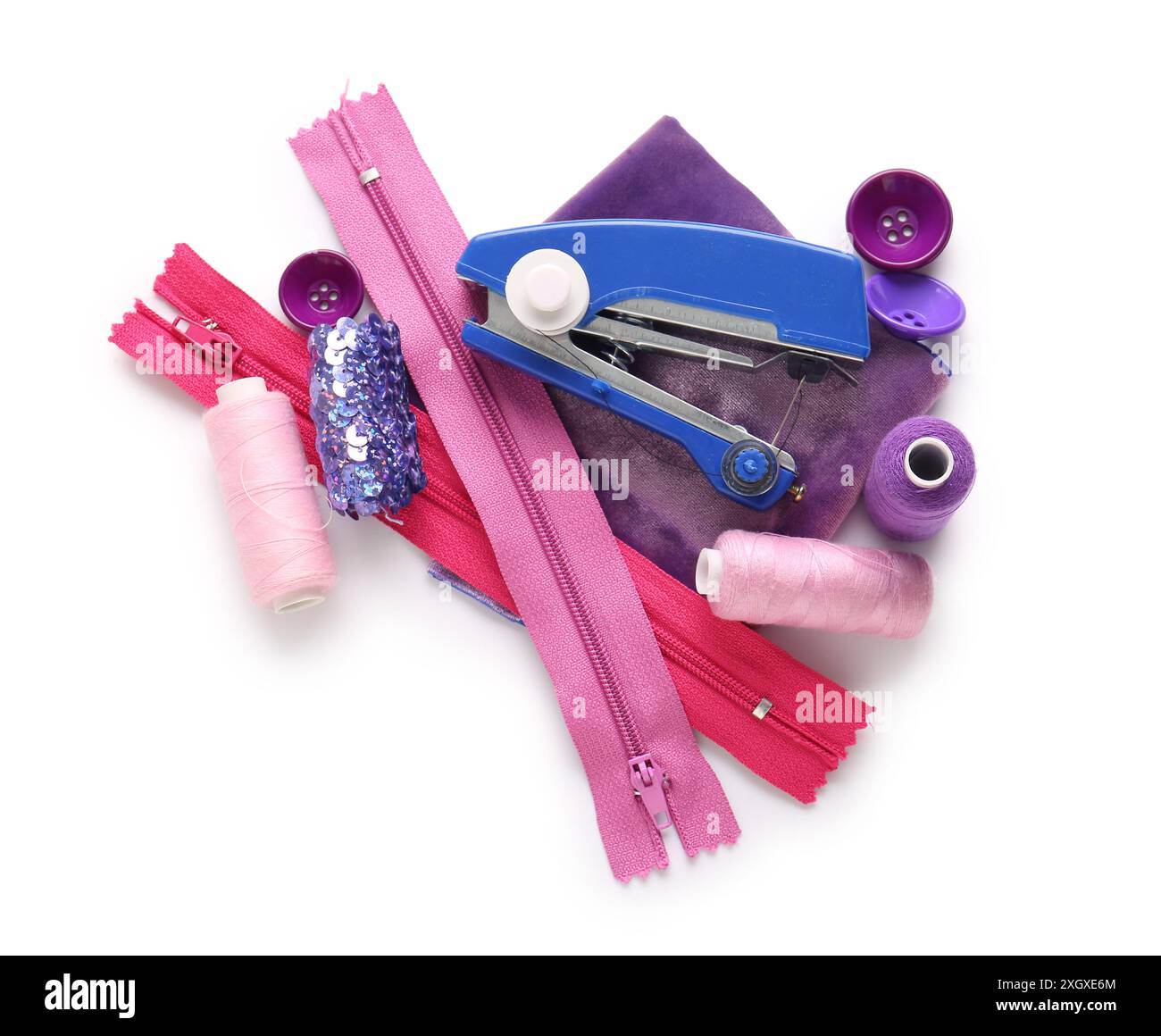 Manual sewing machine with thread spools, zippers and buttons isolated ...