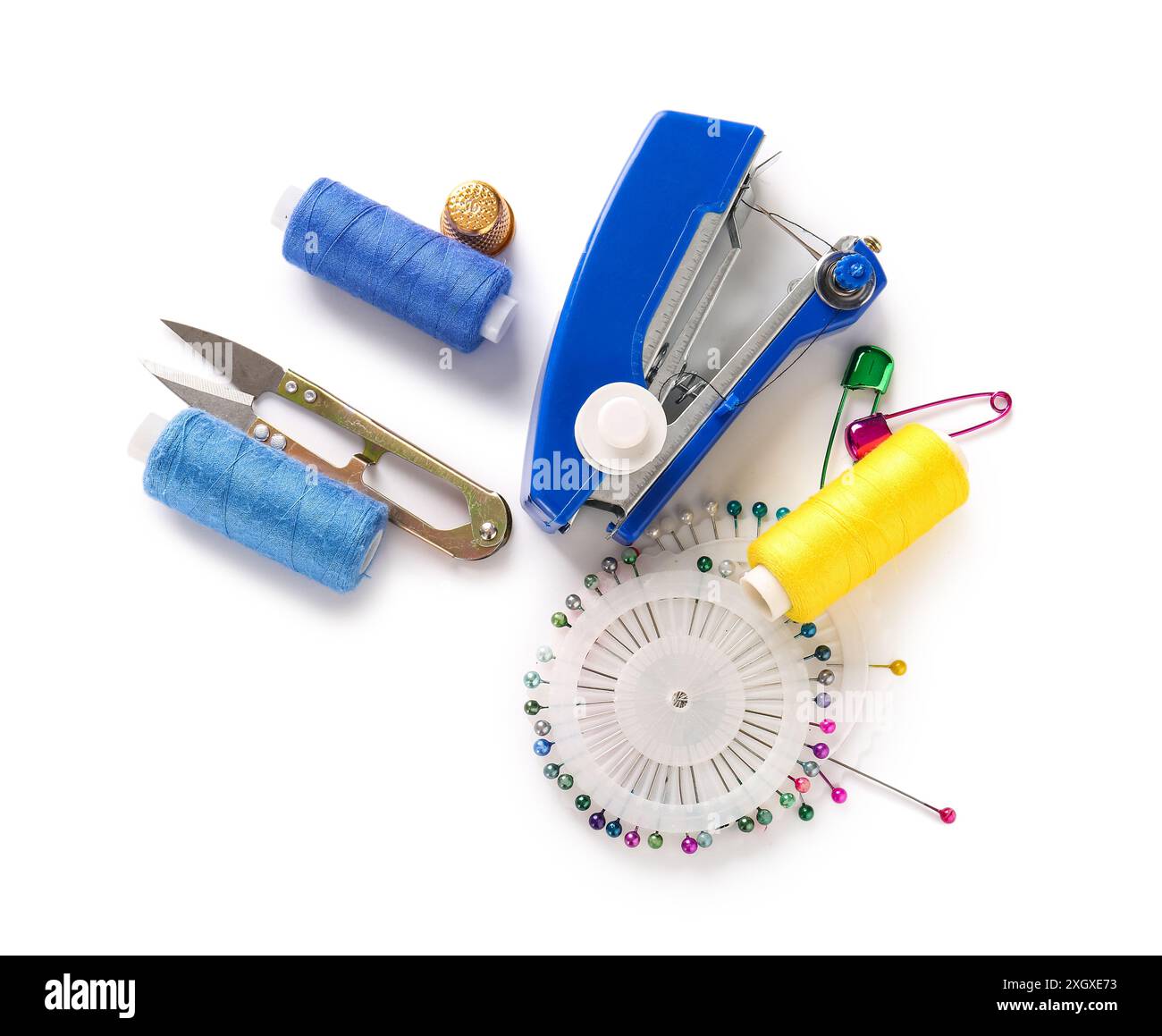 Manual sewing machine with spools, ball pins and thread cutter isolated ...