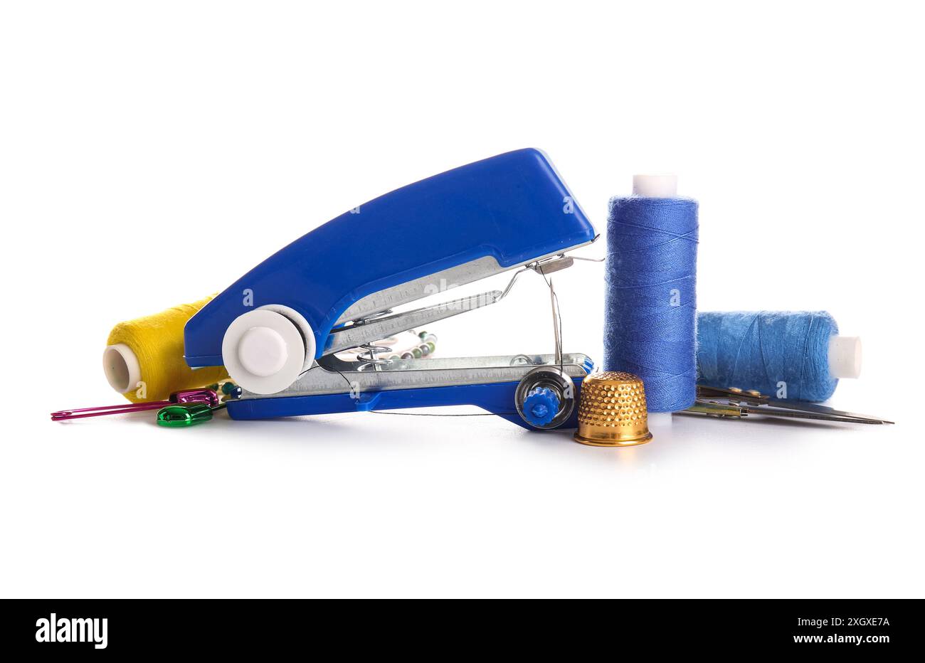 Manual sewing machine with spools, ball pins and thread cutter isolated ...