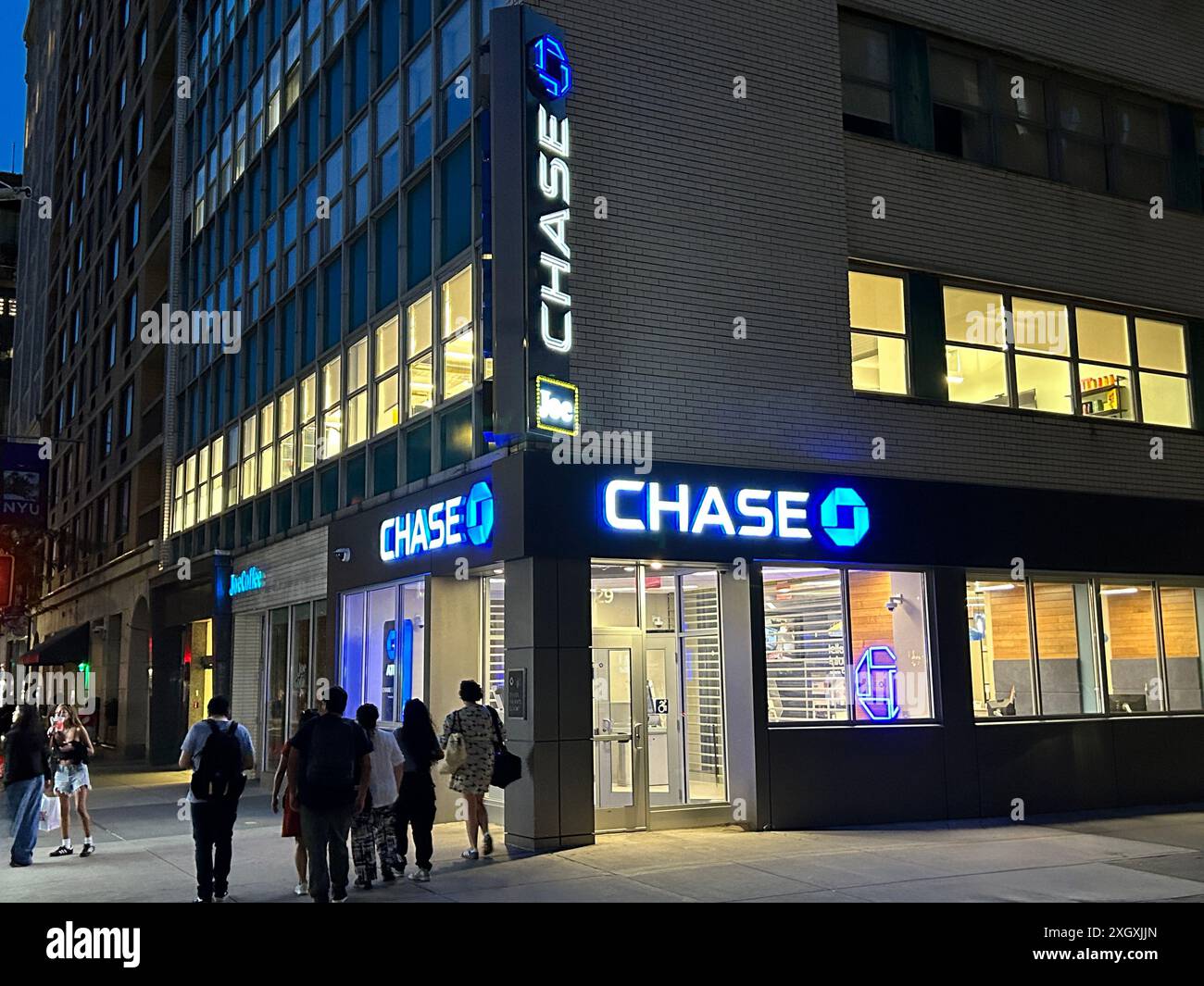 Chase retail bank office, building exterior and street scene at night ...