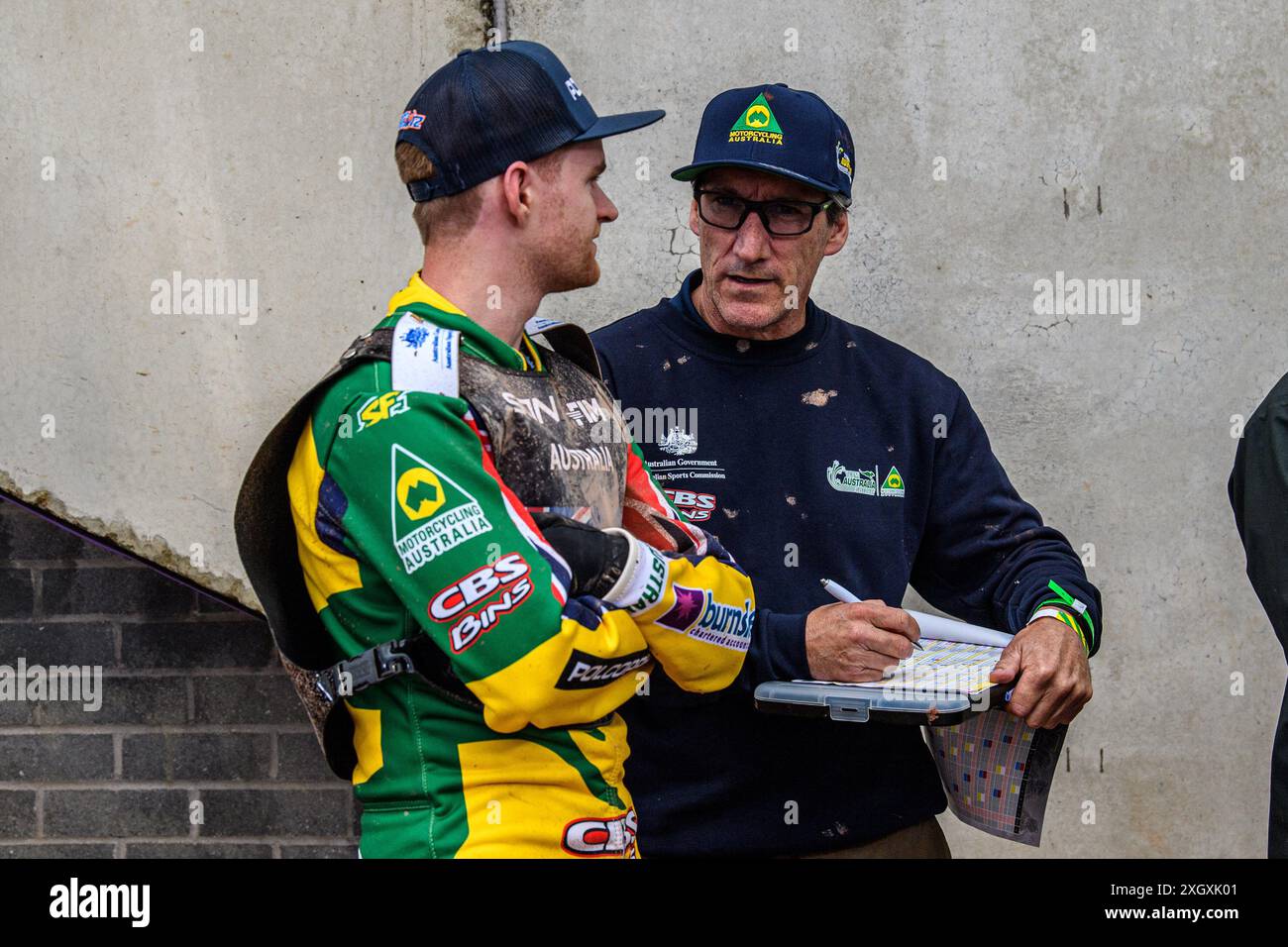 Brady Kurtz of Australia (Left) chats with Australia's Team manager ...