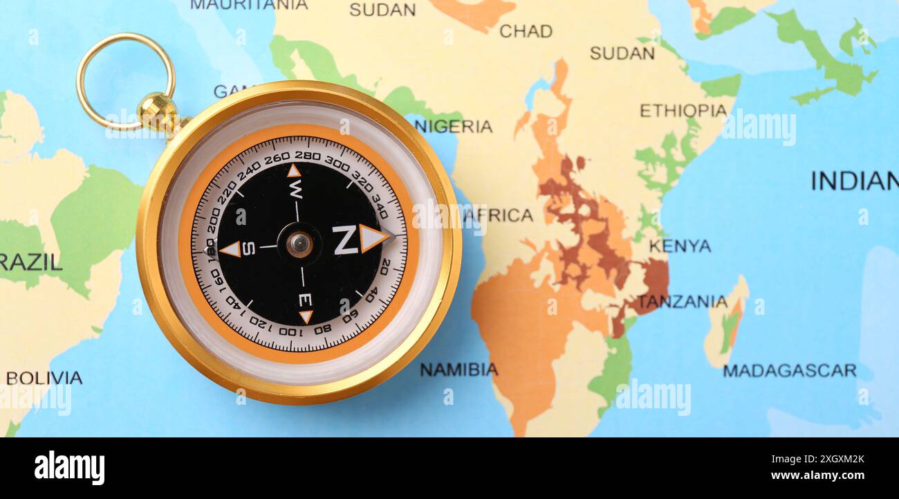 Compass on world map, top view. Banner design with space for text Stock ...