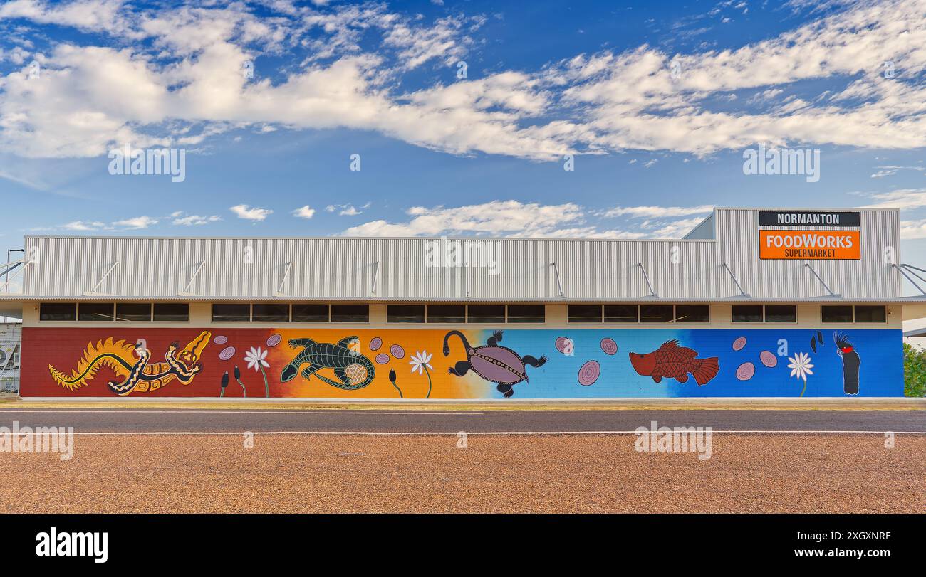 Indigenous art mural of animals in various colors on side of local ...