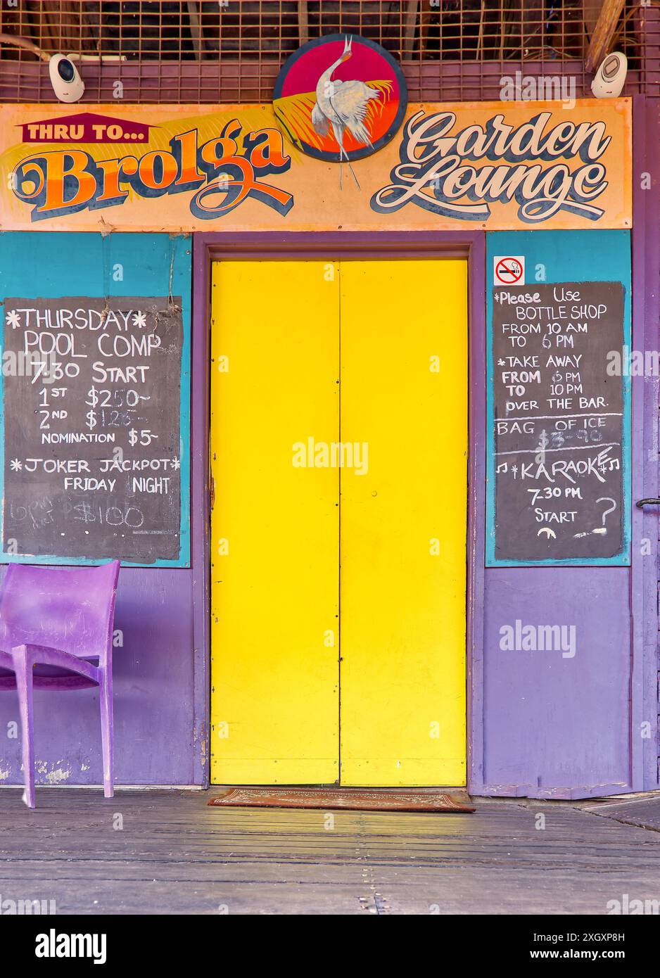 Close up image of exterior of Normanton Purple Pub hotel with chair ...