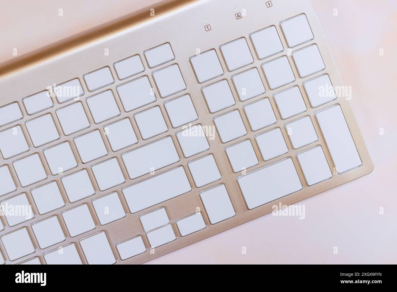 There are blank buttons on clear computer keyboard, which is white ...