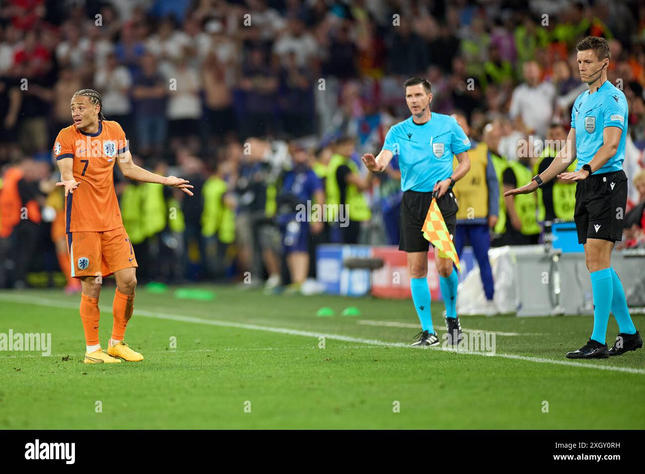 Dortmund. 10th July, 2024. Xavi Simons (L) of the Netherlands reacts ...