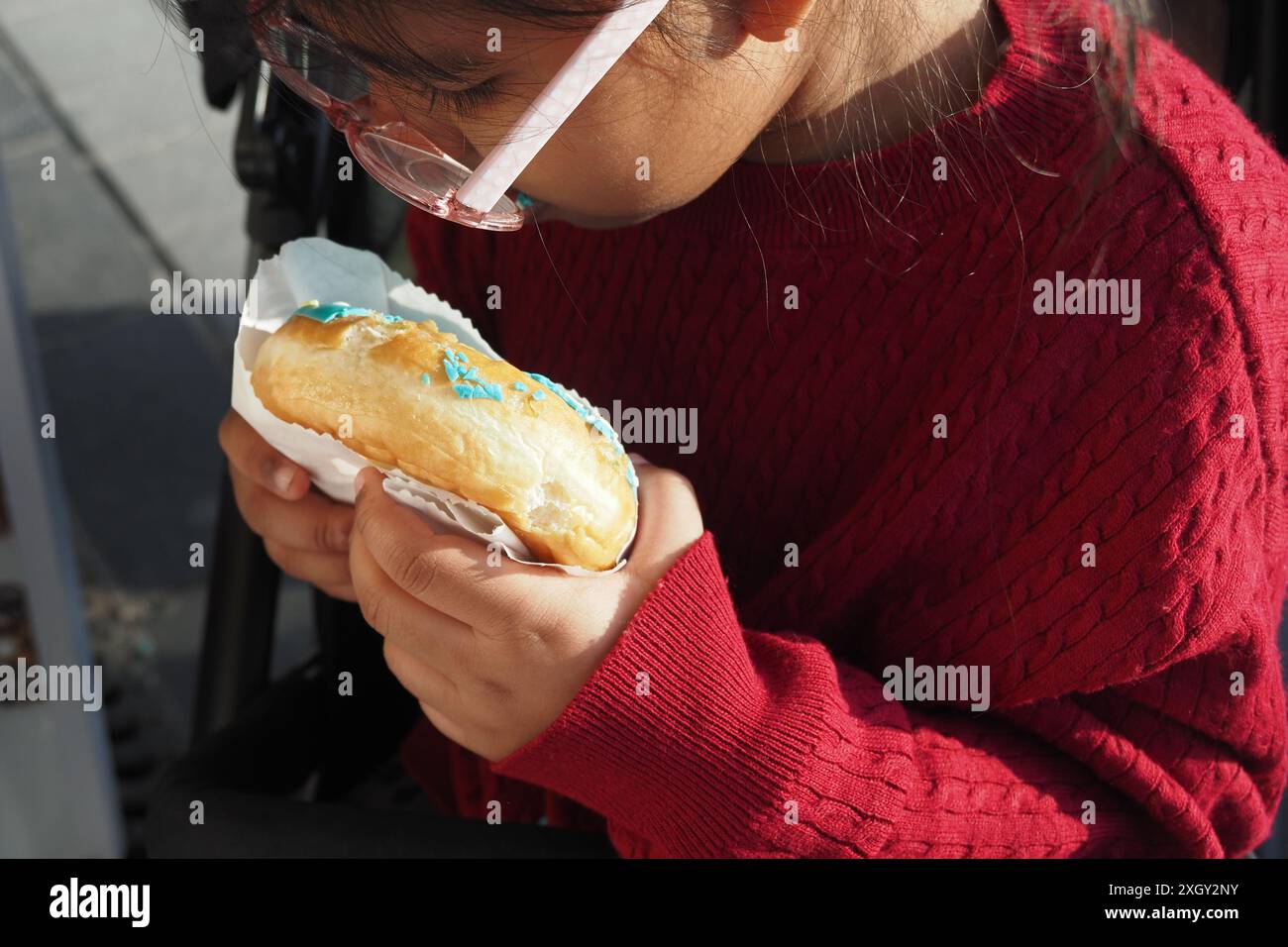 child mouth eating chocolate donuts Stock Photo - Alamy