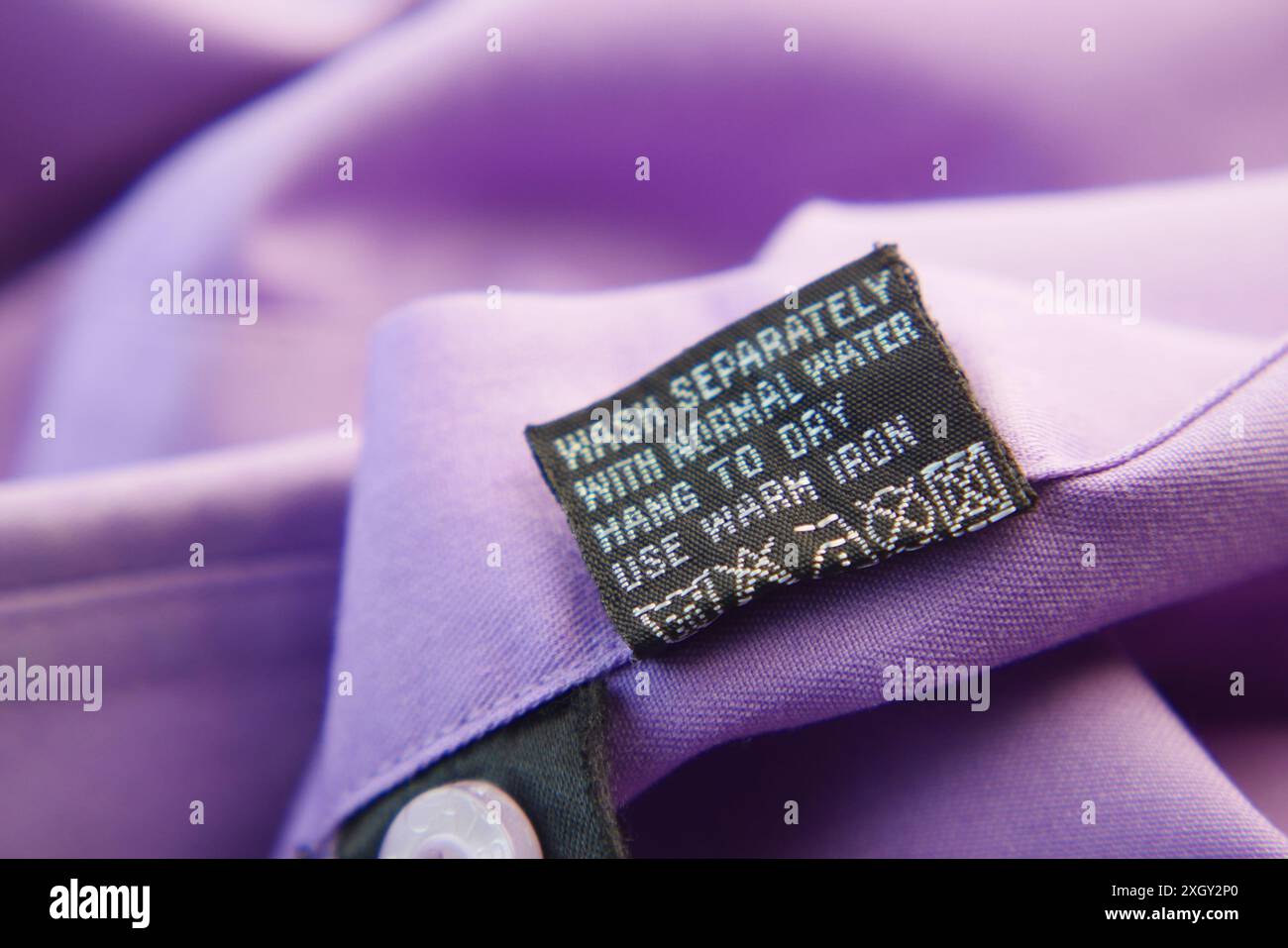 Clothing label with care symbols on a cloth Stock Photo - Alamy