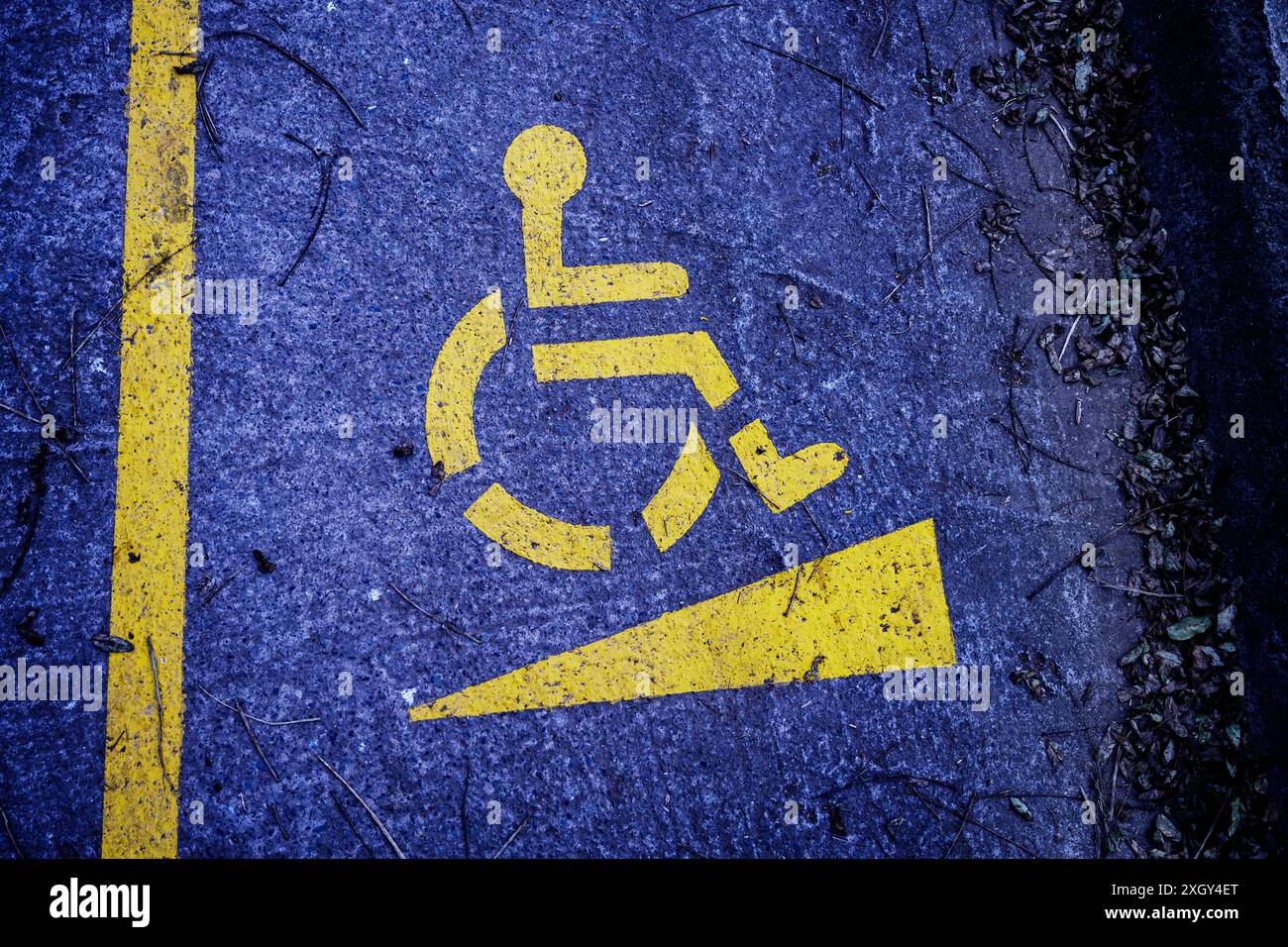 sign or indication of slope for wheelchair or also ramp. sign painted ...