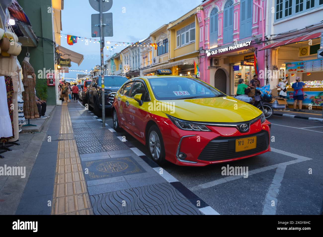 Thailand. Phuket Local Yellow and red color taxi in old town with Sino ...