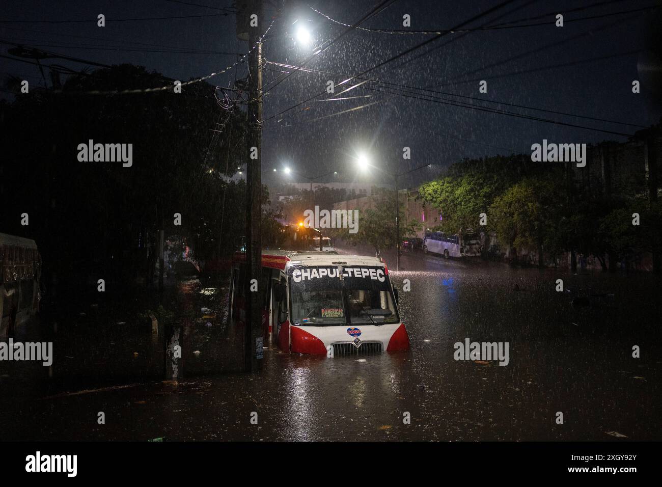 Veracruz, Mexico. 09th July, 2024. A bus stands on a flooded road after ...
