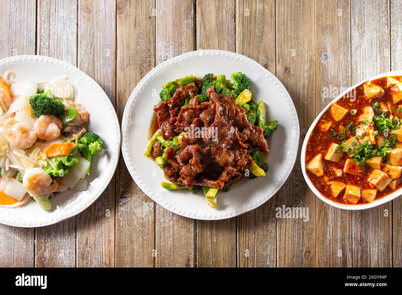 A top down view of several Chinese entrees, featuring beef broccoli ...