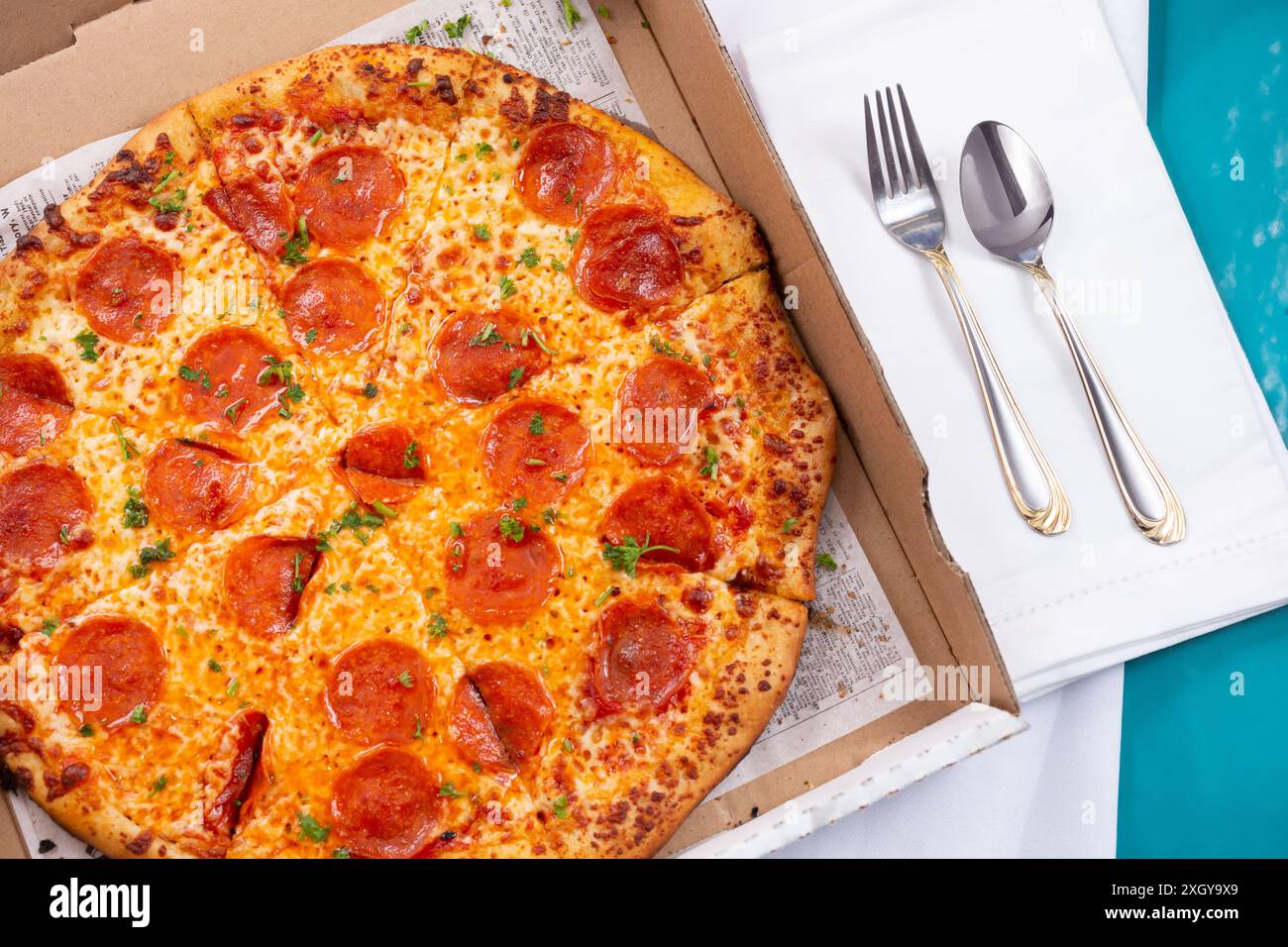 A top down view of a pepperoni pizza in a pizza box Stock Photo - Alamy