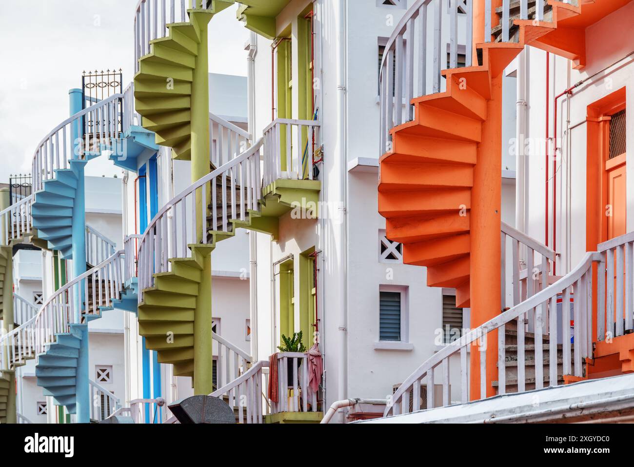 Scenic colorful exterior spiral staircases outside a whitewashed ...