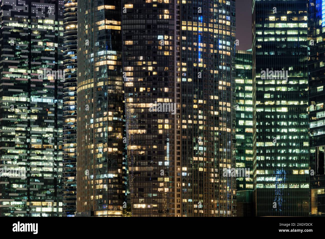 Amazing glowing windows of skyscrapers at evening. View of modern ...