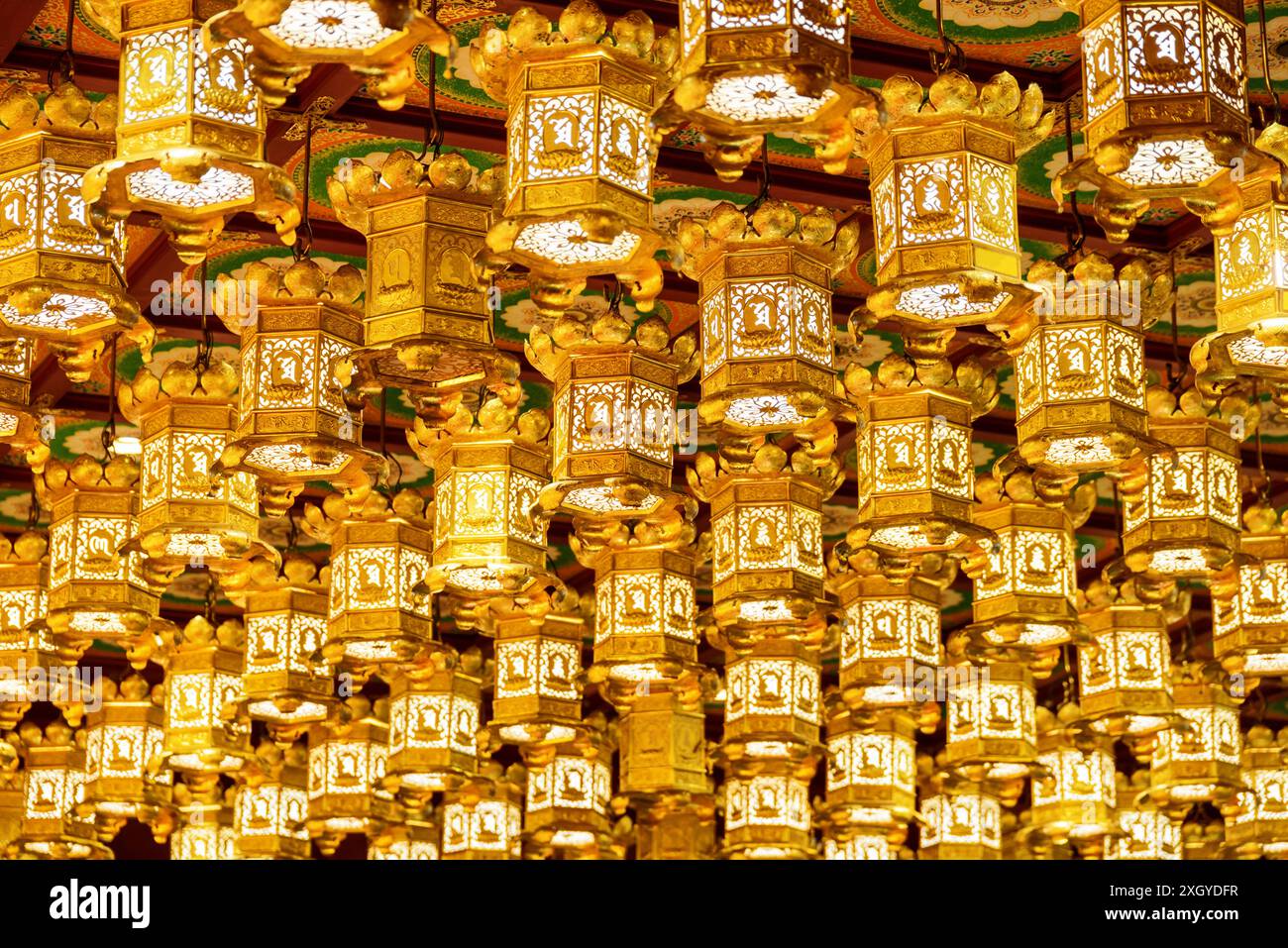 Traditional oriental golden ceiling lanterns in a Buddhist temple Stock ...