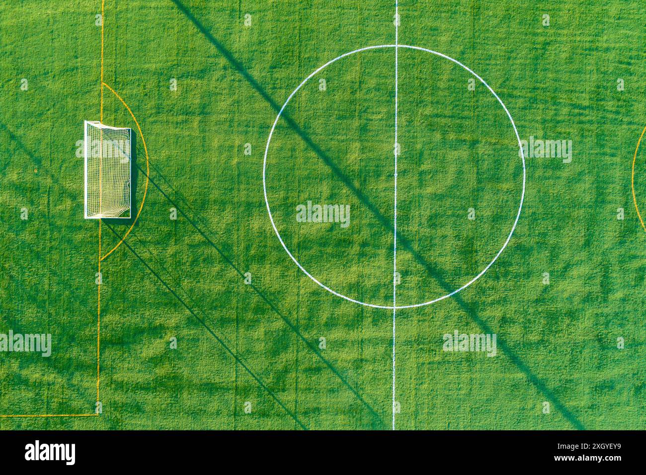 empty soccer field with the goals set up for training, aerial overhead ...