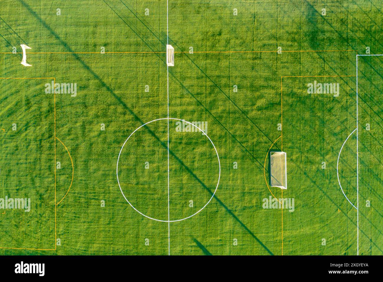empty soccer field with the goals set up for training, aerial top view ...
