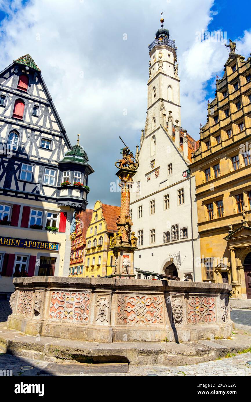 Old clock tower and St. George's fountain by the market square in ...