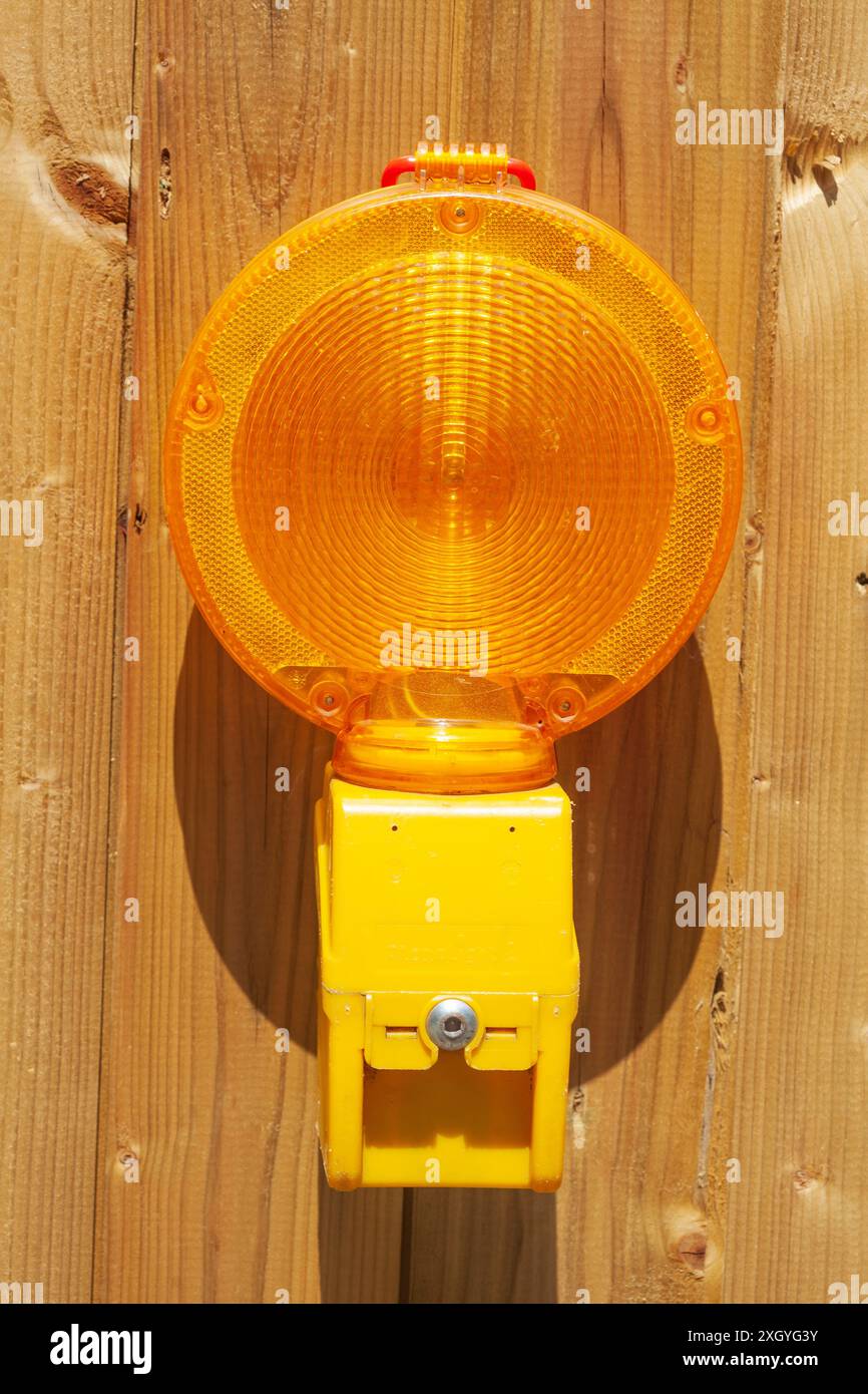 Orange construction site lamp on a site fence, Germany Stock Photo - Alamy