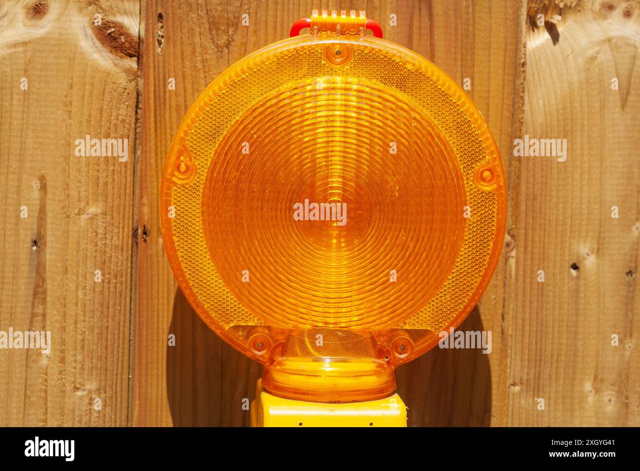 Orange construction site lamp on a site fence, Germany Stock Photo - Alamy