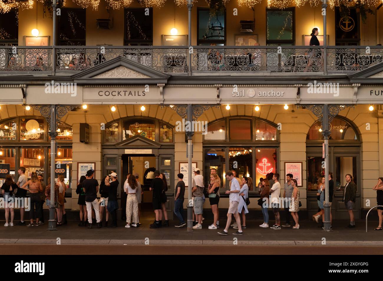 Young people line up to enter a music venue in Fremantle Stock Photo ...