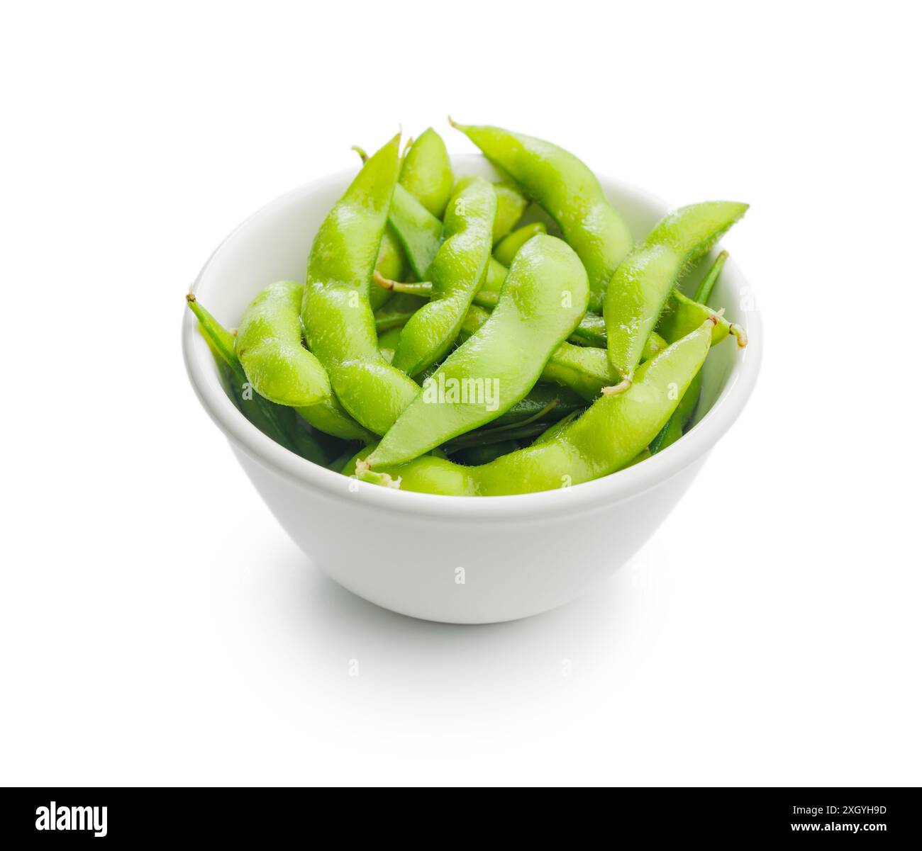 Green edamame pods. Fresh soybeans in bowl isolated on a white ...
