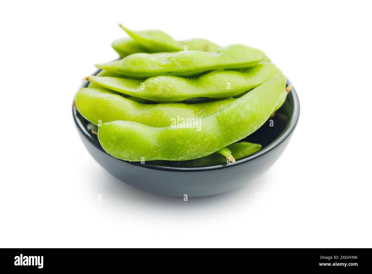 Green edamame pods. Fresh soybeans in bowl isolated on a white ...