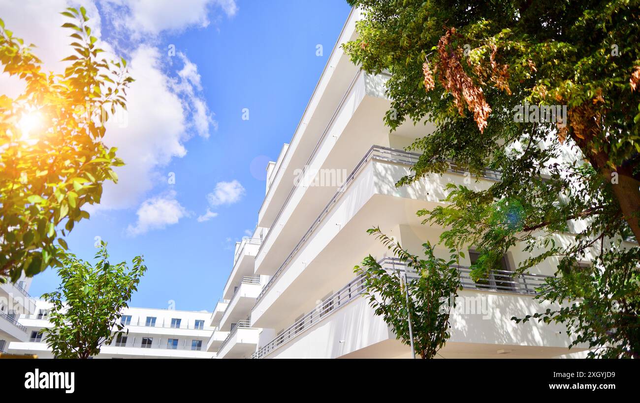 Modern residential building with new apartments in a green residential ...