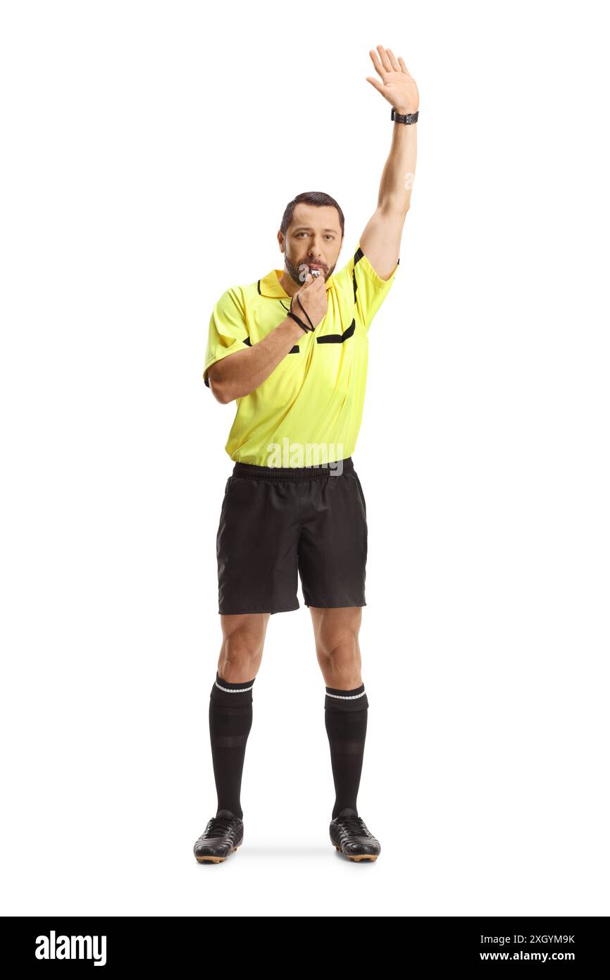 Football referee with arm up blowing a whistle isolated on white ...