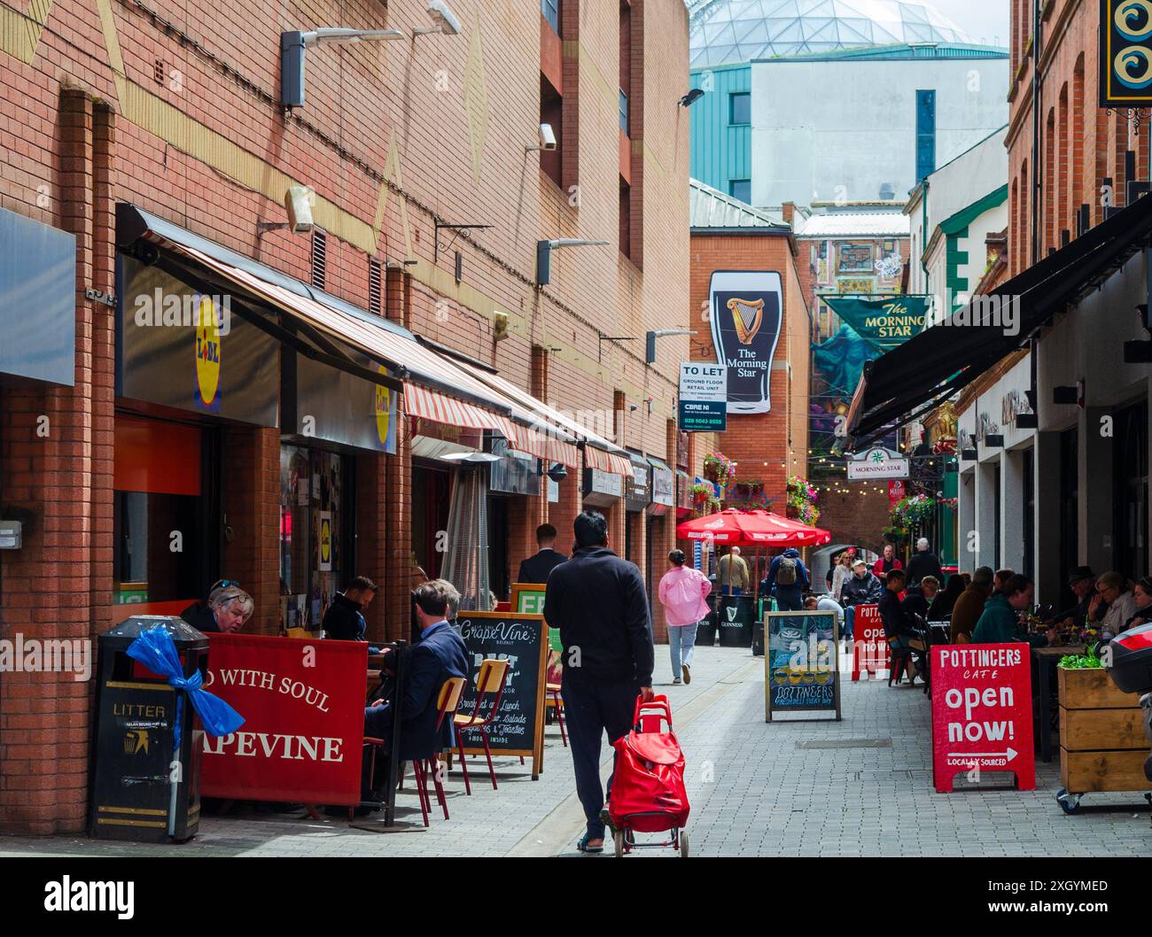 Belfast , County Antrim Northern Ireland July 05 2024 -People eating ...