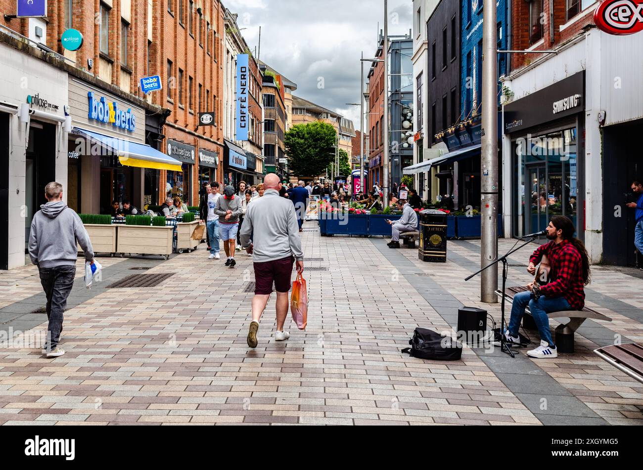 Belfast , County Antrim Northern Ireland July 05 2024 - Busker playing ...