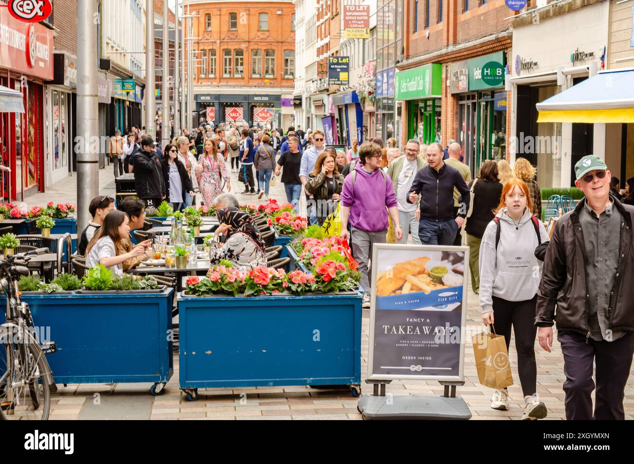 Belfast , County Antrim Northern Ireland July 05 2024 -People eating ...