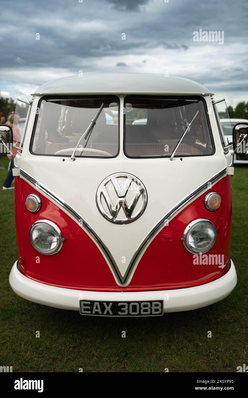 Red and white, two-tone, split-screen classic VW camper on display at the June 2024 Banbury Car ...