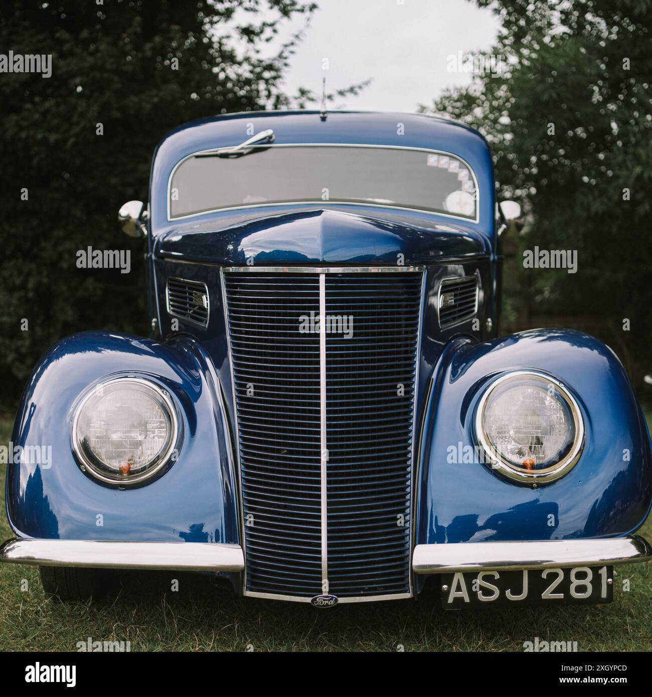 A blue restored 1955 Ford Popular hot rod, on display at the June 2024 ...
