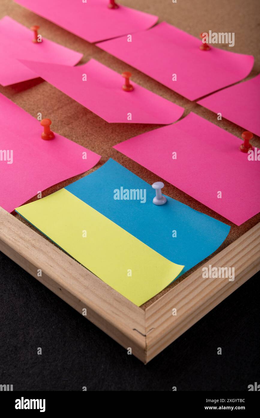 A vibrant image captures a collection of Post-it notes arranged to form ...