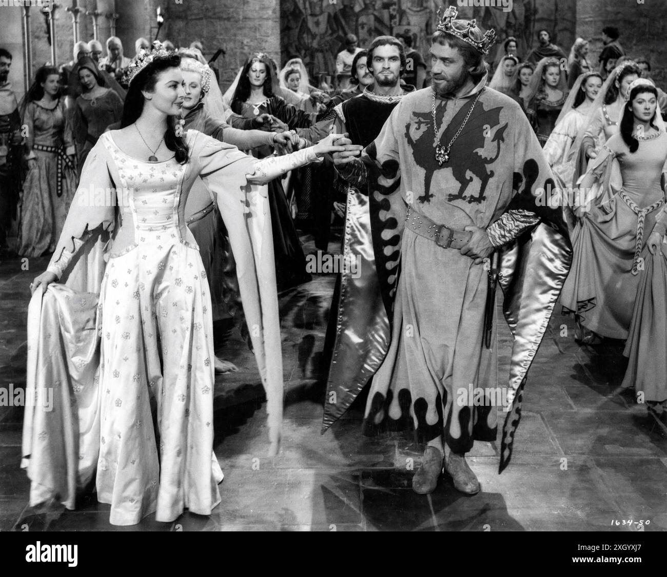 AVA GARDNER as Queen Guinevere and MEL FERRER as King Arthur dancing ...
