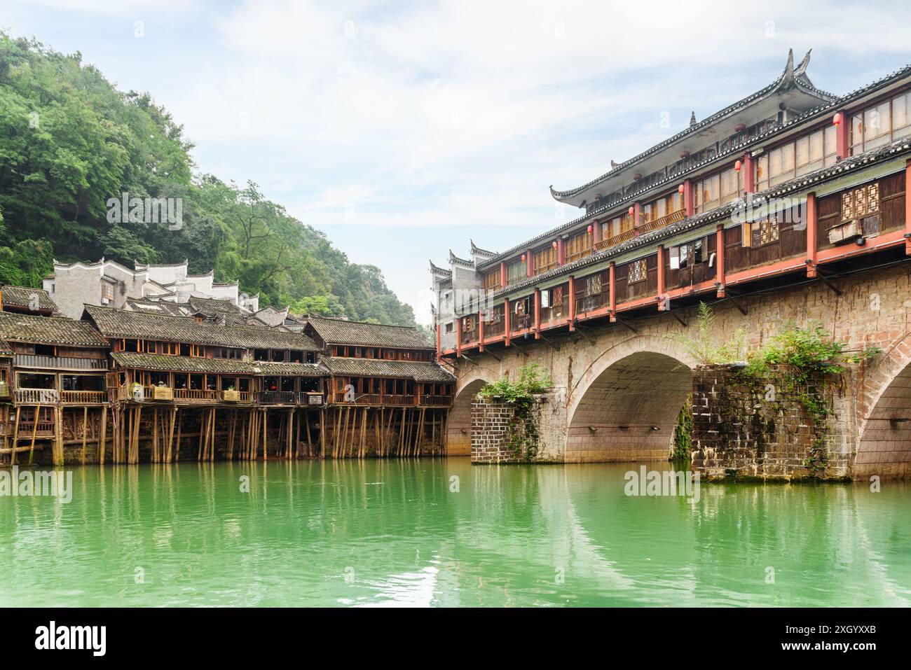 Old authentic traditional Chinese wooden riverside houses on stilts and ...