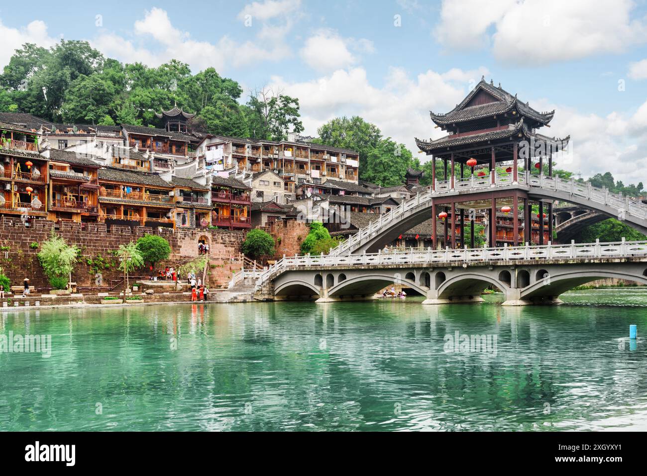 View of amazing bridge reflected in water of the Tuojiang River (Tuo ...