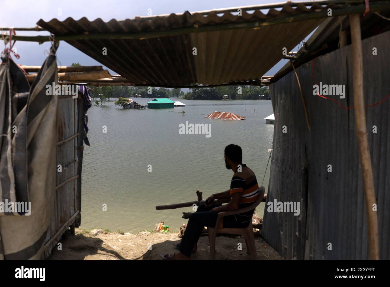 July 11, 2024, Kurigram, Kurigram, Bangladesh: A man sits in a ...
