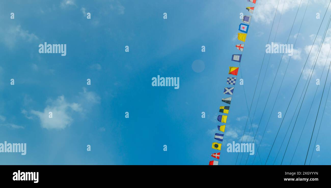 International maritime signal flags on a flagpole and masts on a ...