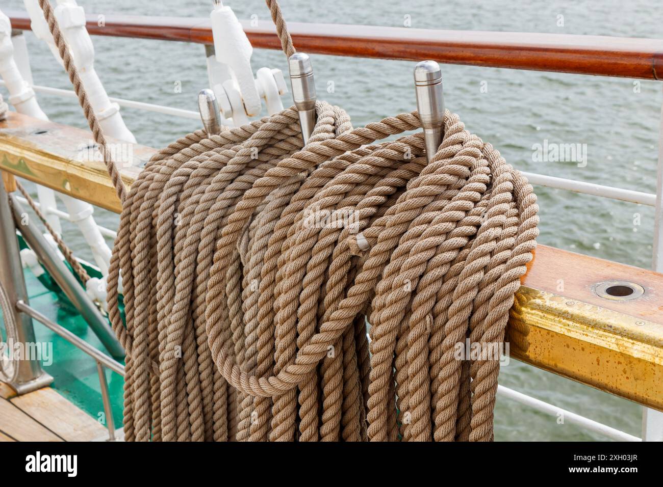 Pine trail with fixed running rigging. An old sailing ship. Closeup of ...