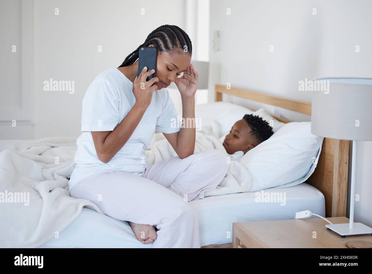 Mom, black child and sick on phone call in bed for medical care ...