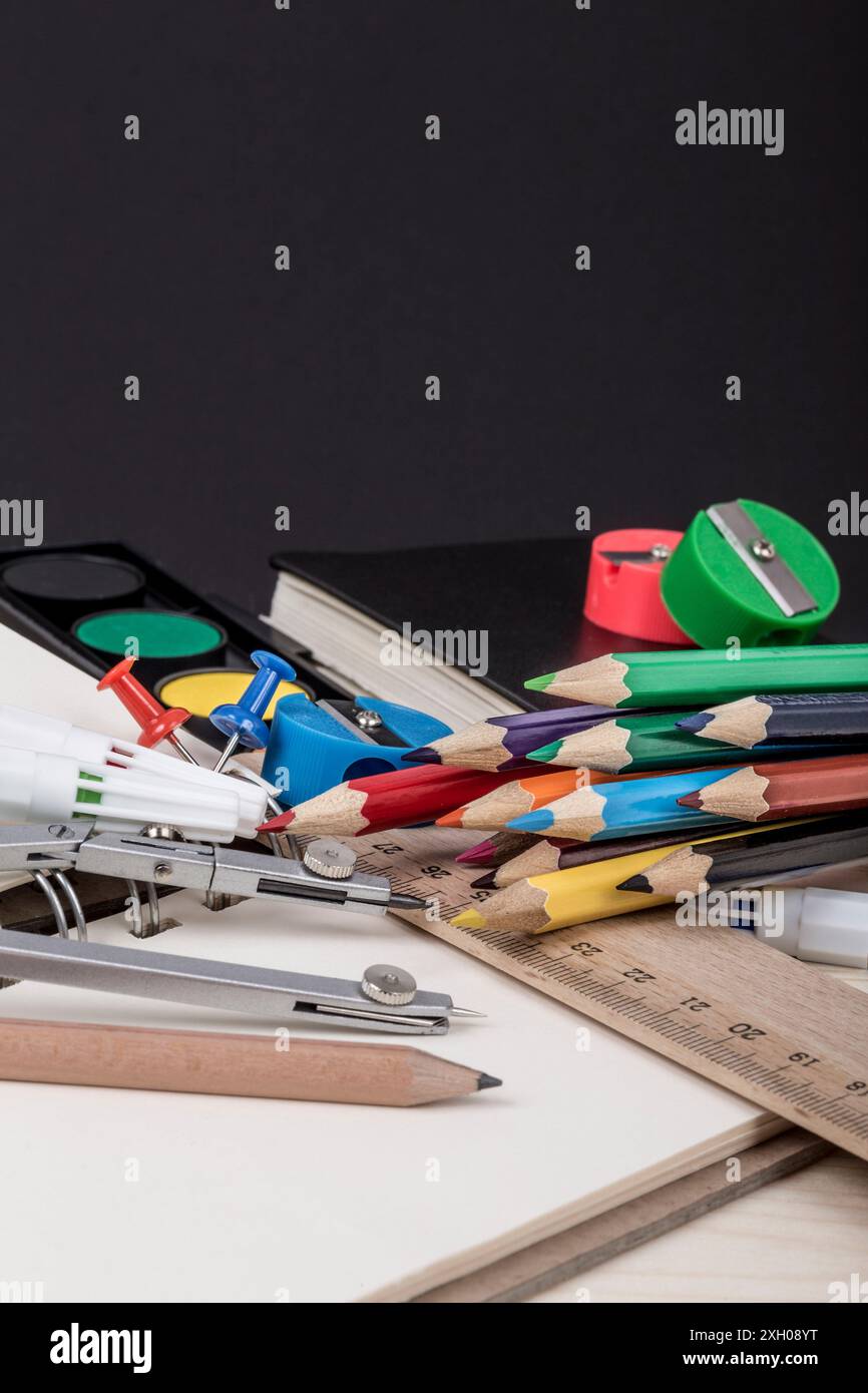 back to school template with multiple stationery over black background ...