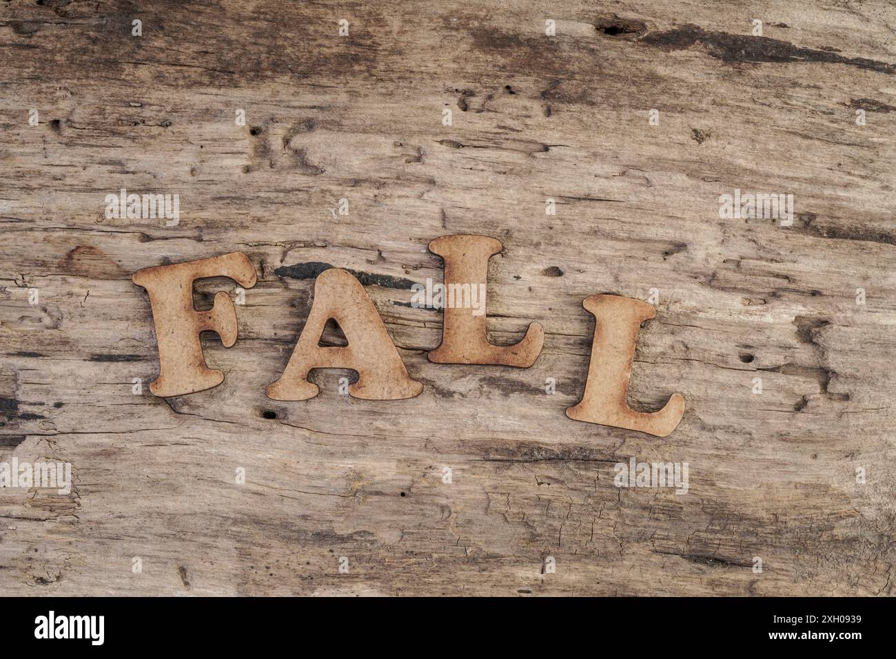 Word FALL written with wooden letters table Stock Photo - Alamy