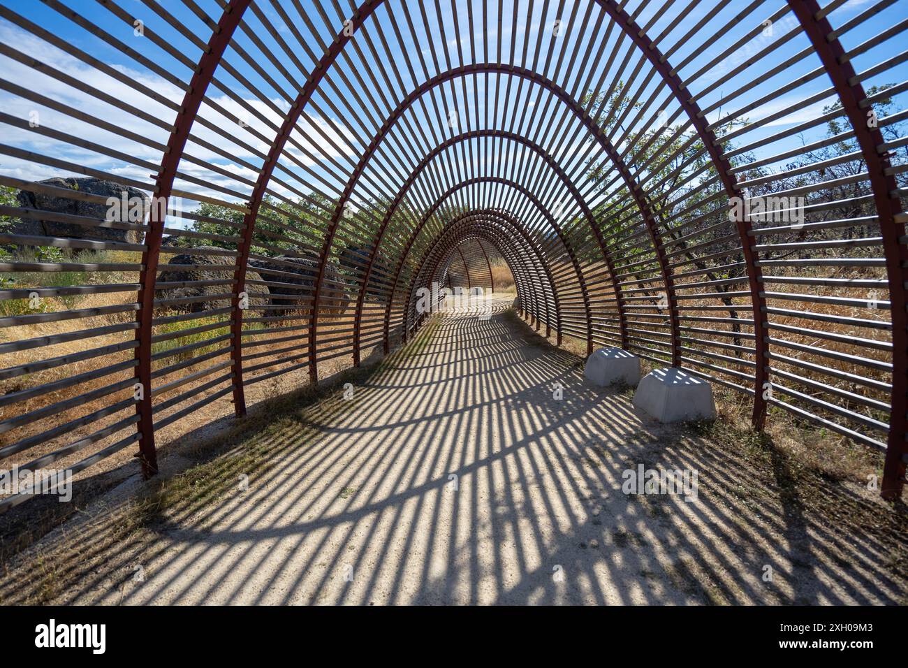 Tunnel in wooden slats for people to pass through in the interior of ...
