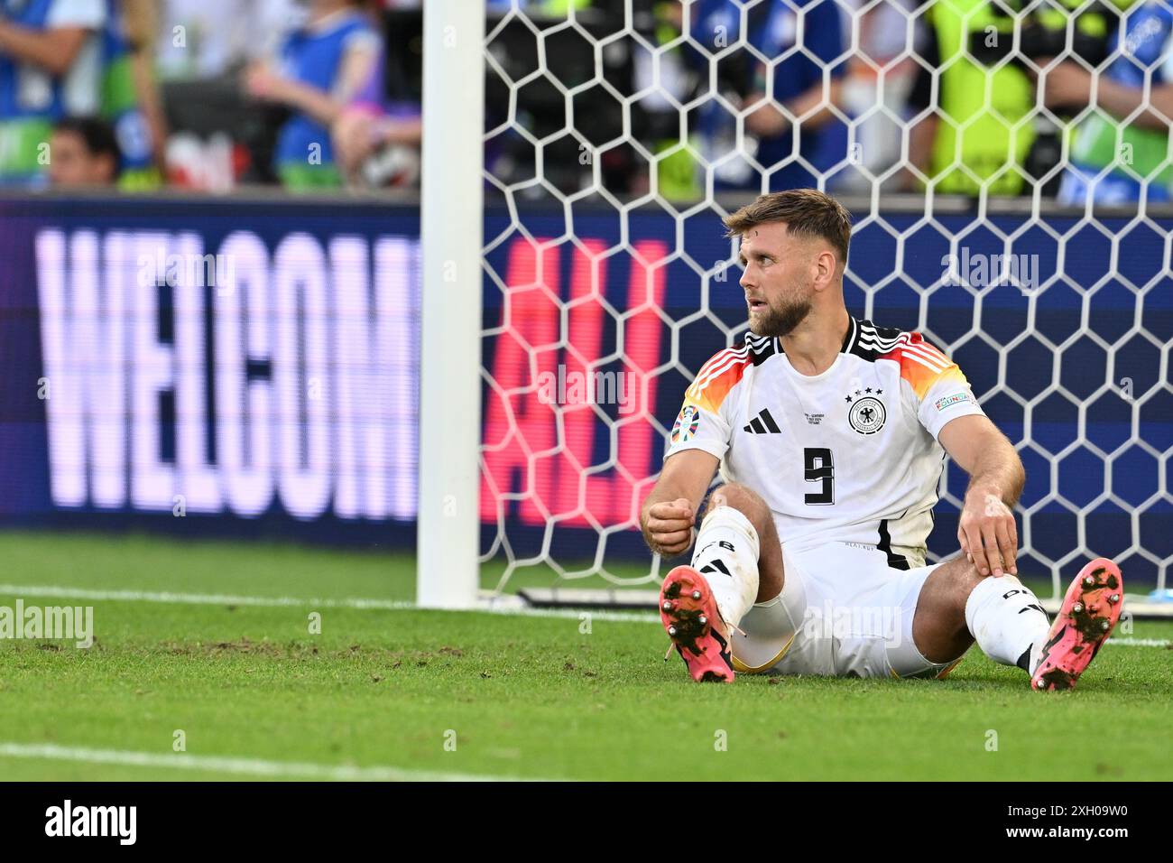 Niclas Fullkrug (9) of Germany looking dejected and disappointed after ...