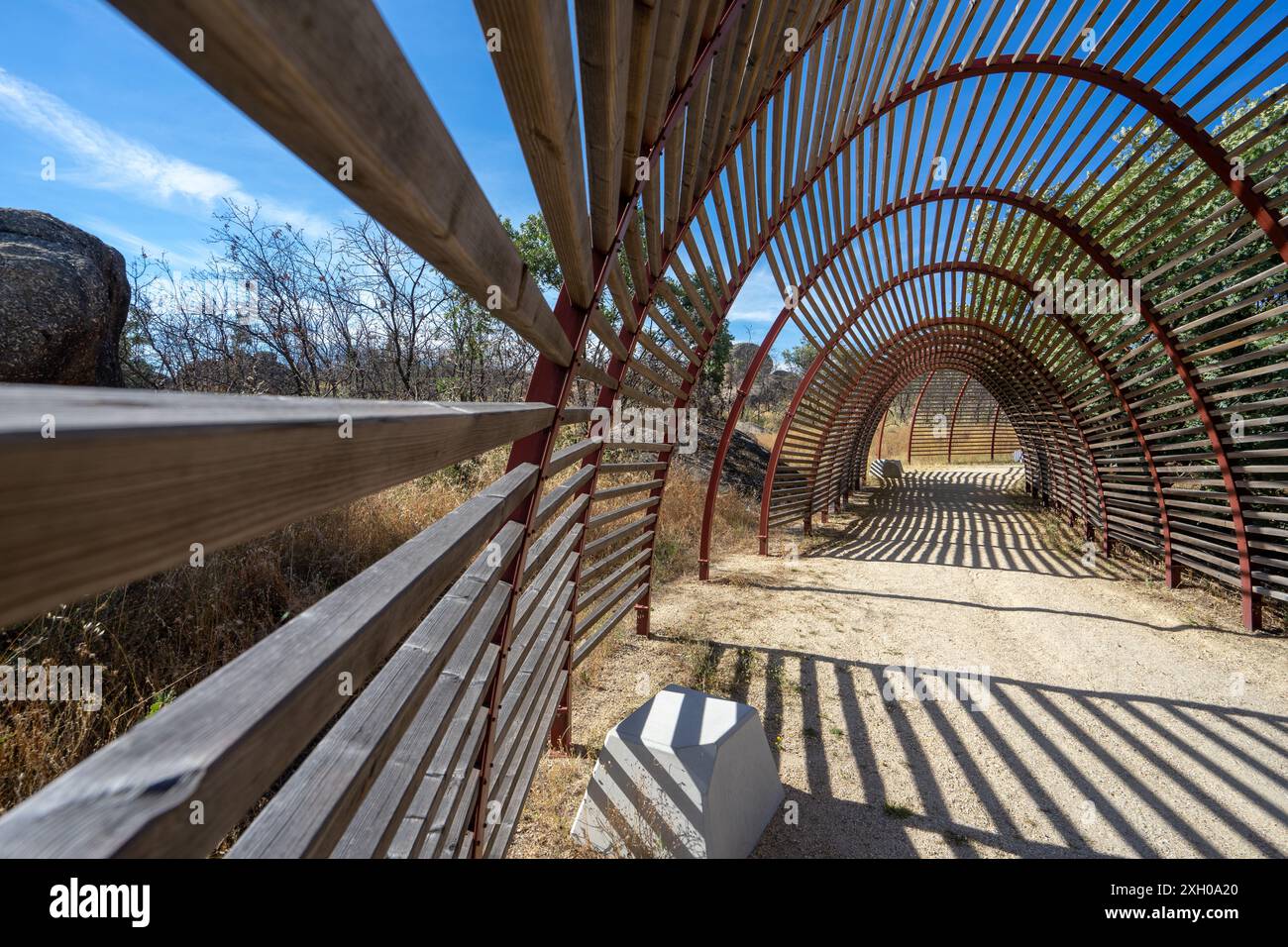 Tunnel in wooden slats for people to pass through in the interior of ...