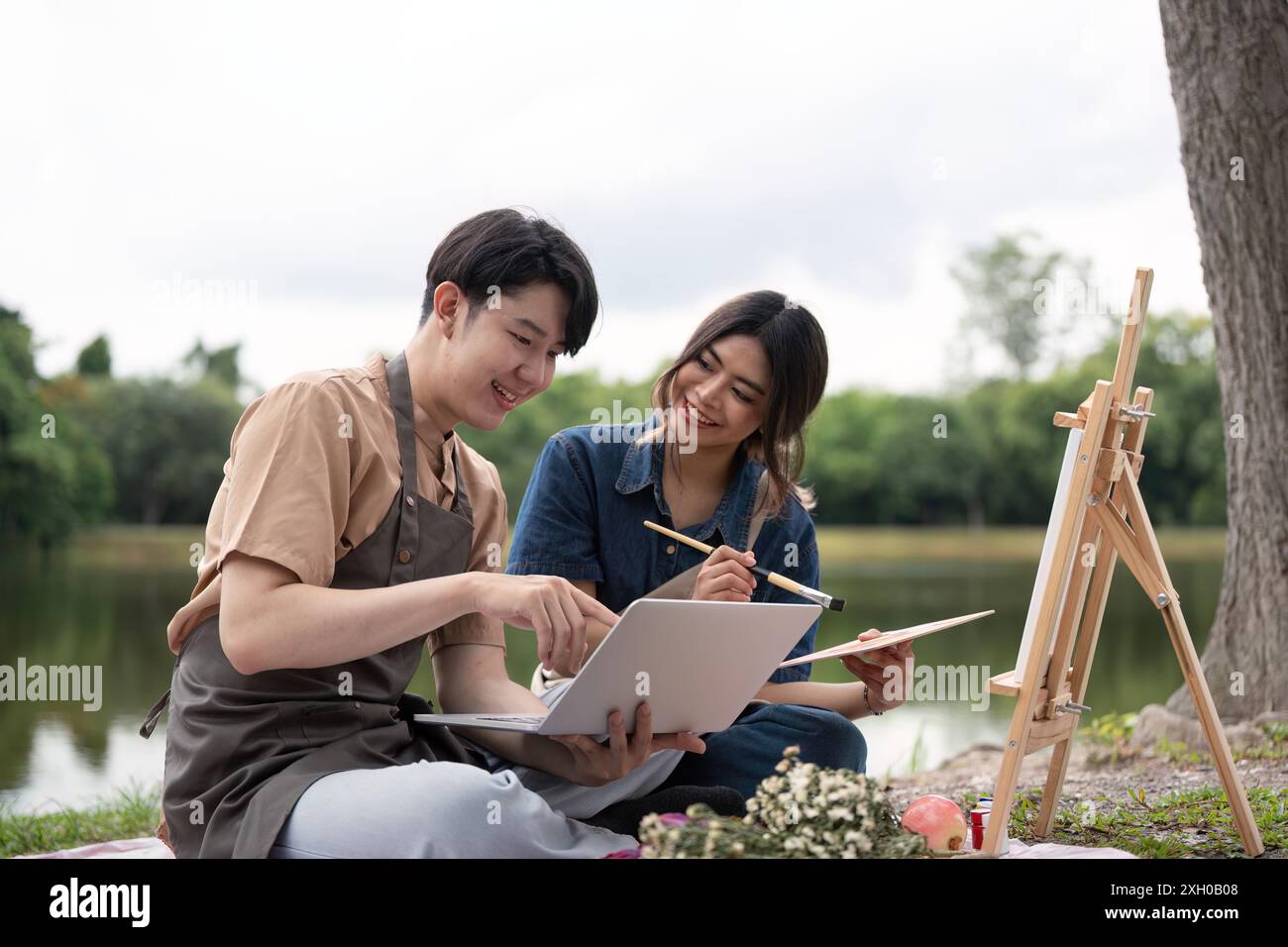 Romantic Picnic Couple Drawing Outdoors by the Lake. Creative Art ...