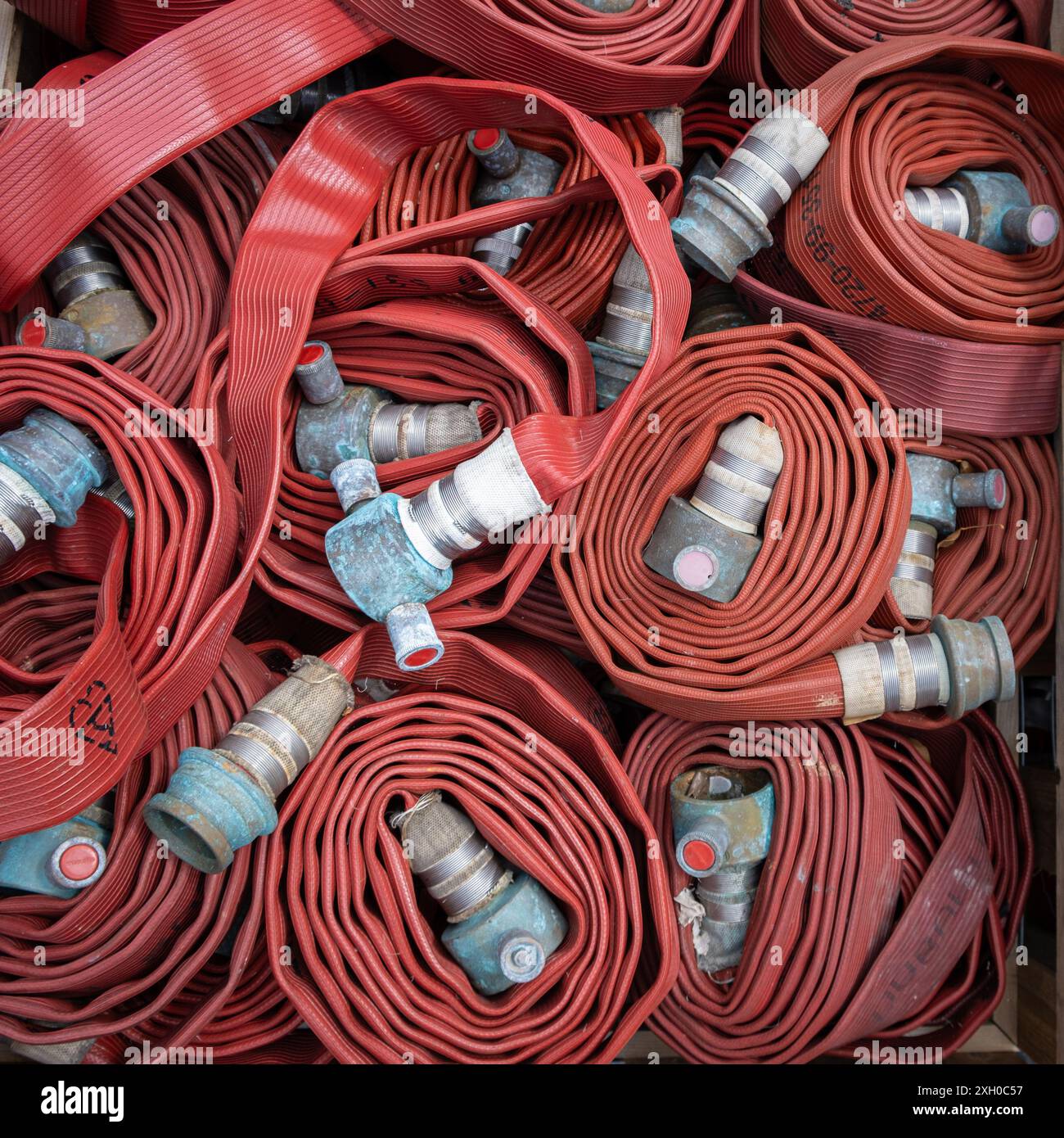 Fire Hoses coiled up Stock Photo - Alamy